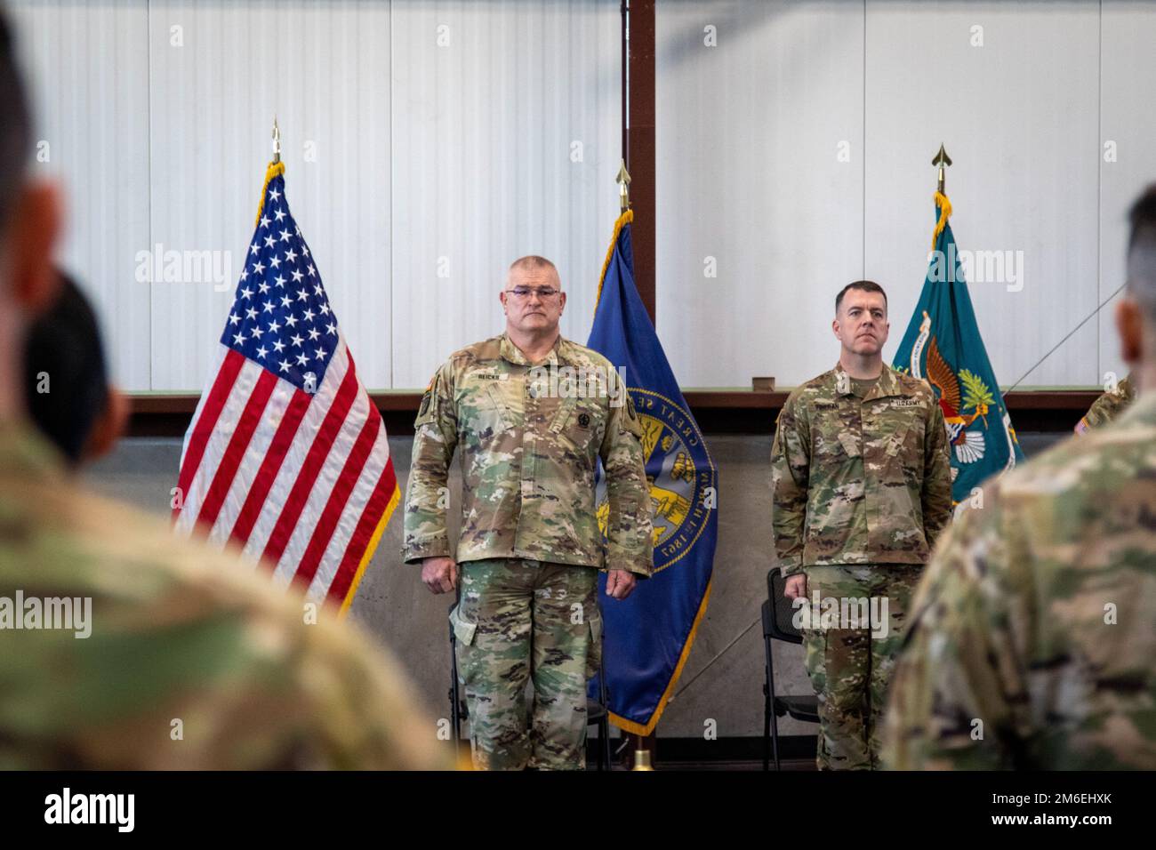 Command Sgt. Maj. Dean Reicks (left) stands at attention during a ...