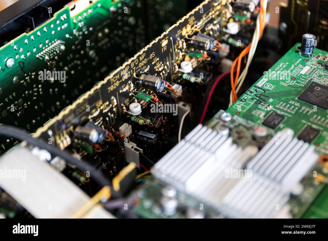 Close up of some green and black circuit boards in an open electronic ...