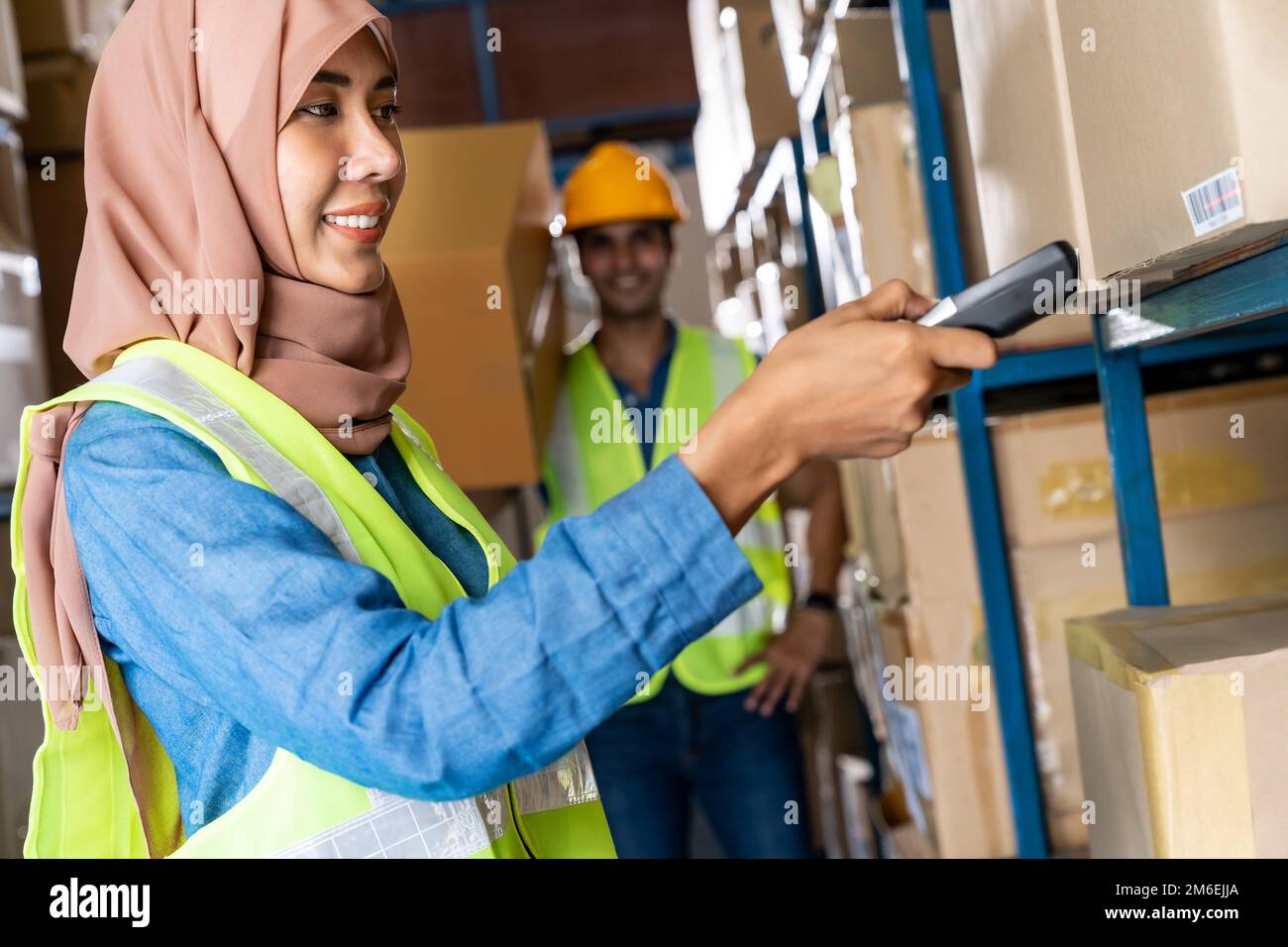 Asian Islam Muslim warehouse worker do inventory Stock Photo - Alamy