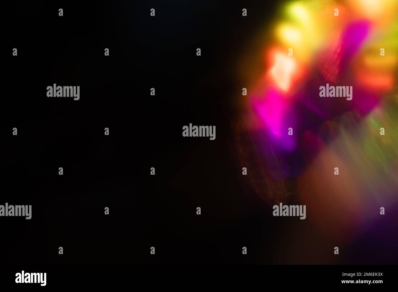Abstract blurred colorful lens flare bokeh on black Stock Photo - Alamy