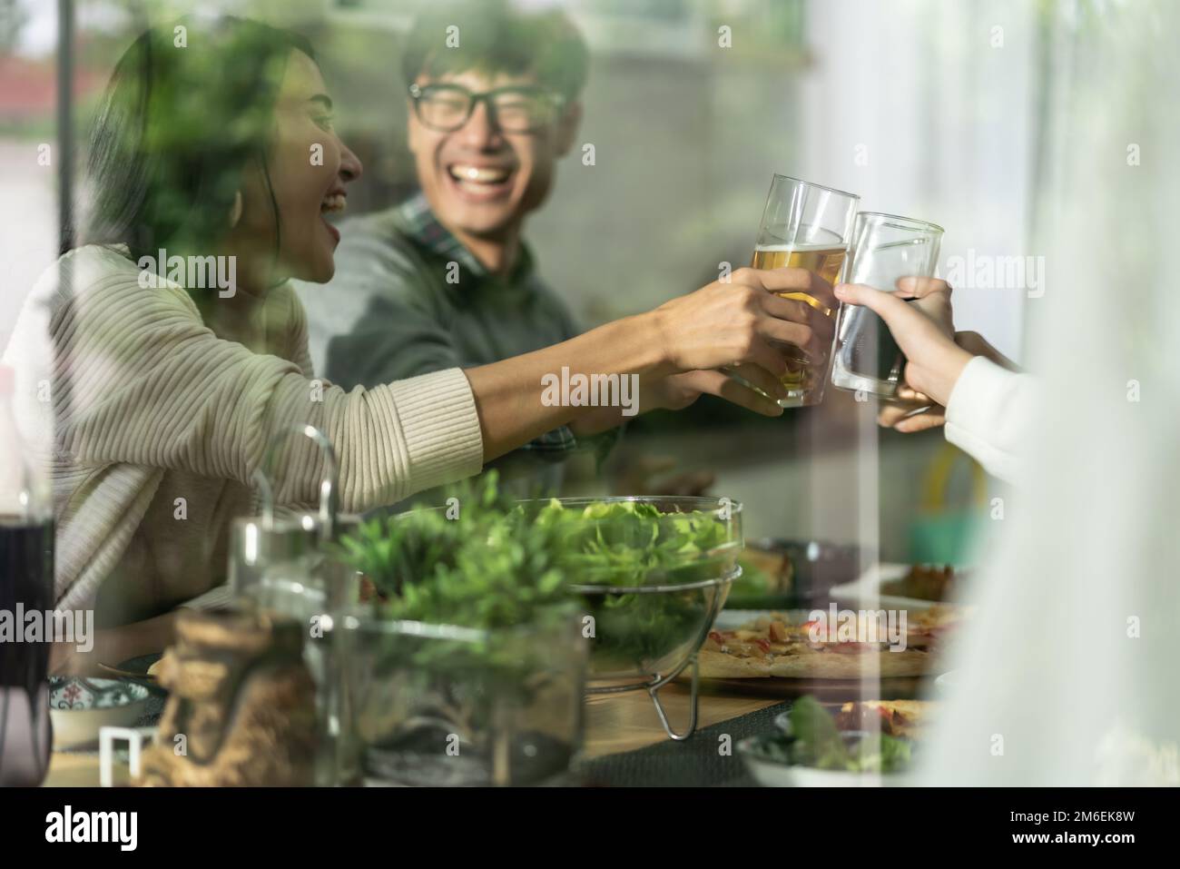 Happy asian multigenerational family cheers together Stock Photo - Alamy