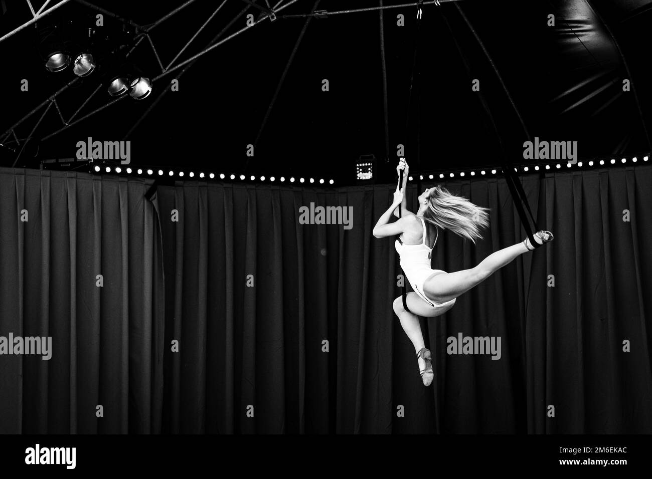 A black and white elegant close up portrait of a circus entertainer ...