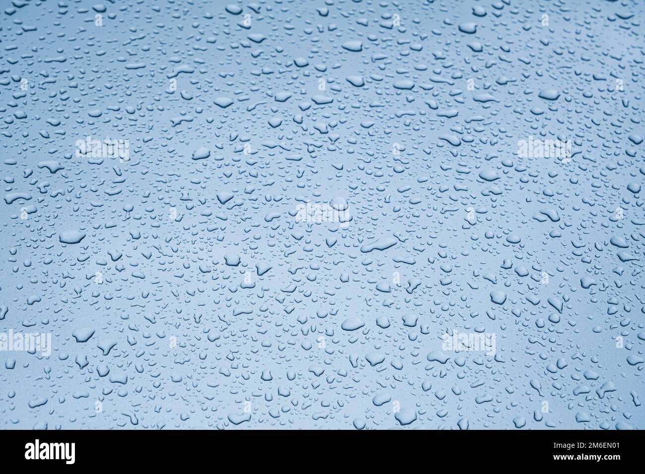 Close up rain drop on surface of car's body after passed from rainy ...