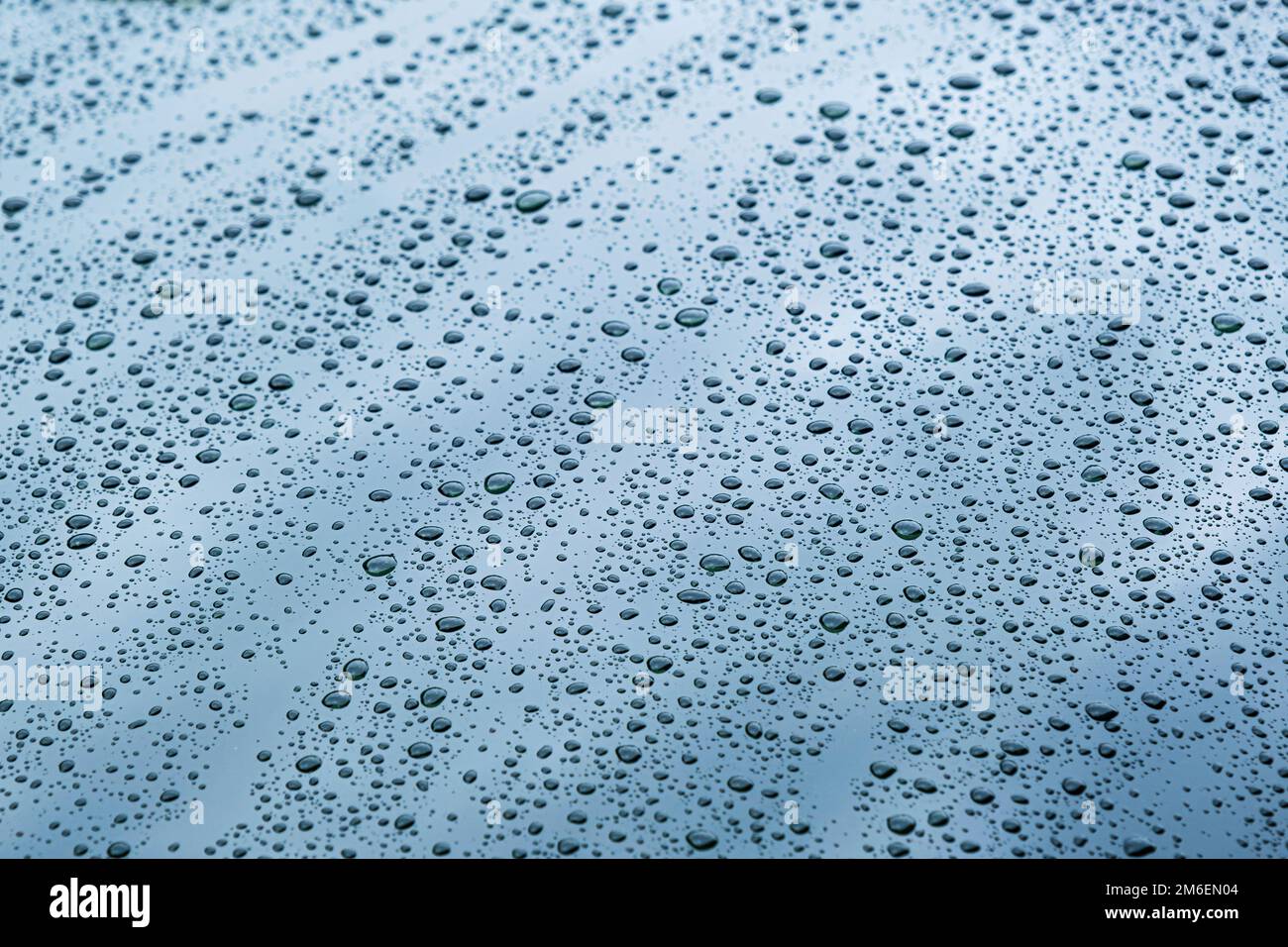 Close up rain drop on surface of car's body after passed from rainy ...