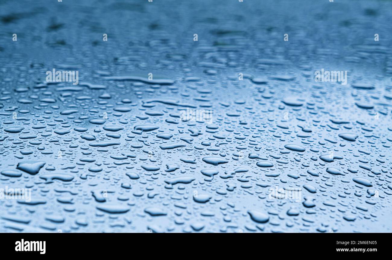 Close up rain drop on surface of car's body after passed from rainy ...