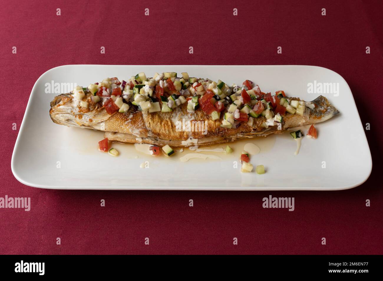 African dishe culinary Still Life. Grilled fish with small cut ...