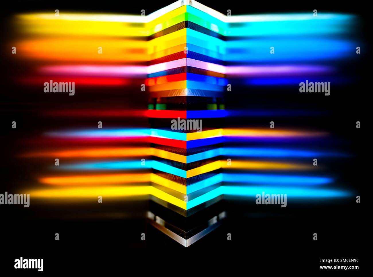 light through Stack of different colours Cast Acrylic Sheet on black ...