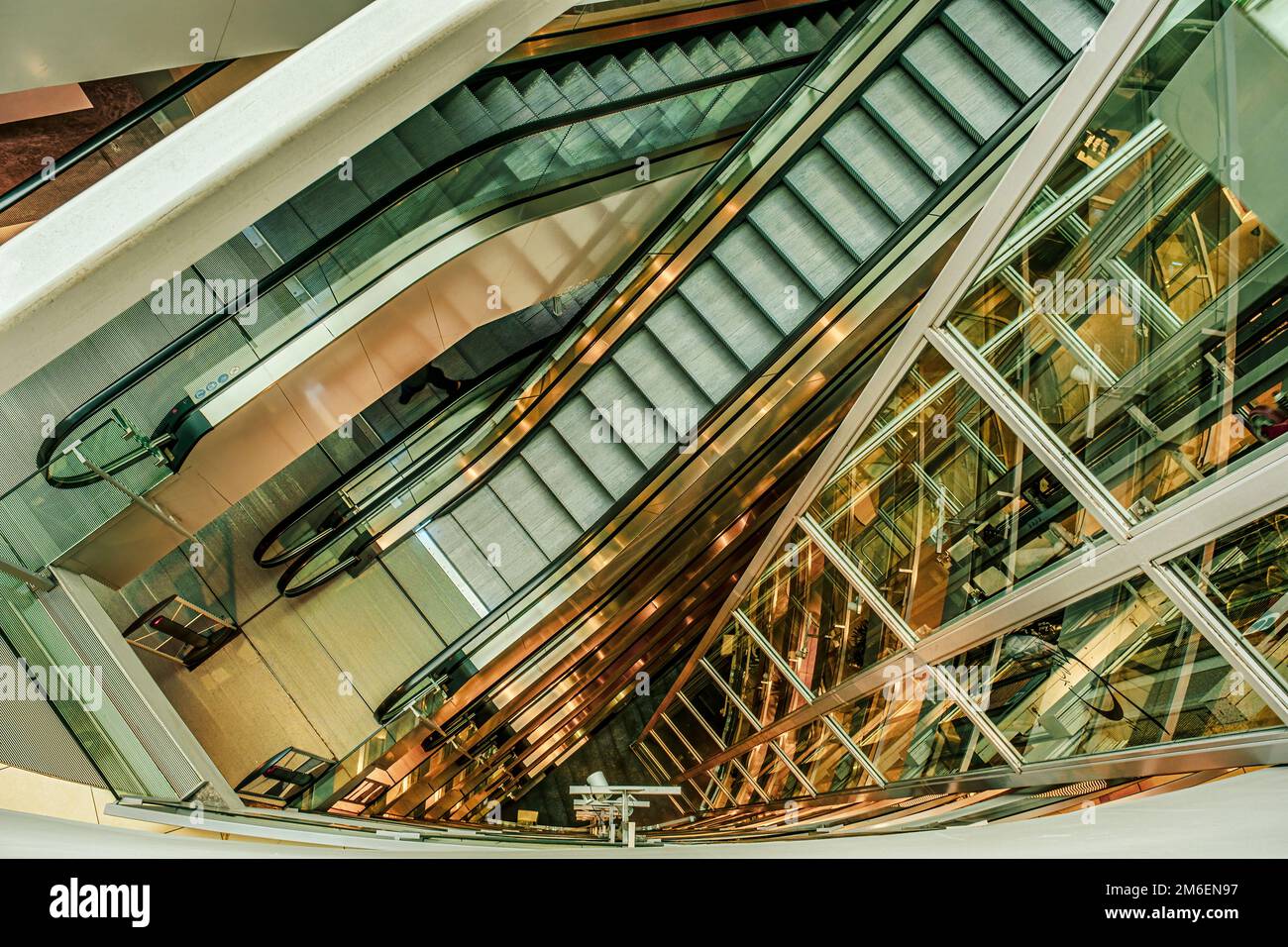 empty escalators and glass elevator, top down view Stock Photo - Alamy