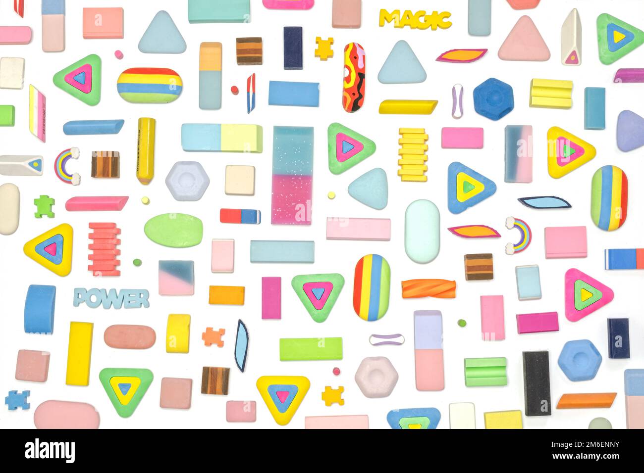 various shapes and colors of erasers arranged isolated on white ...