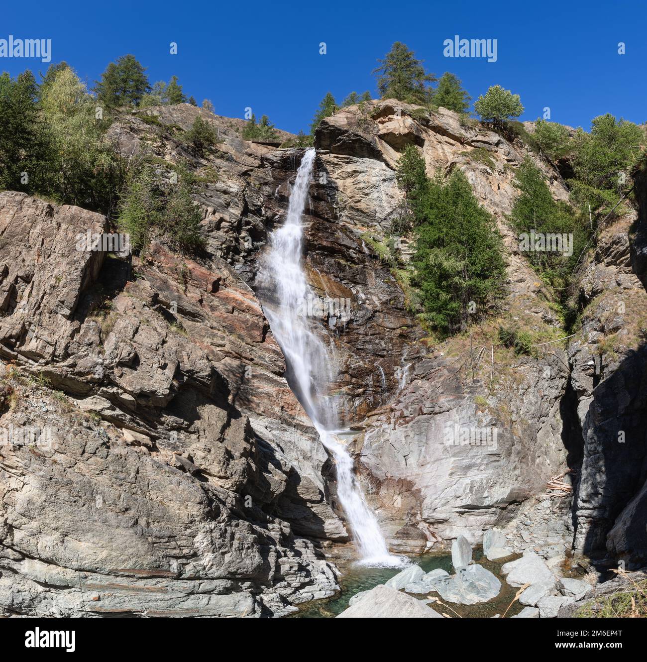 Panoramic view of rare green trees on rocks and streams of mountain ...