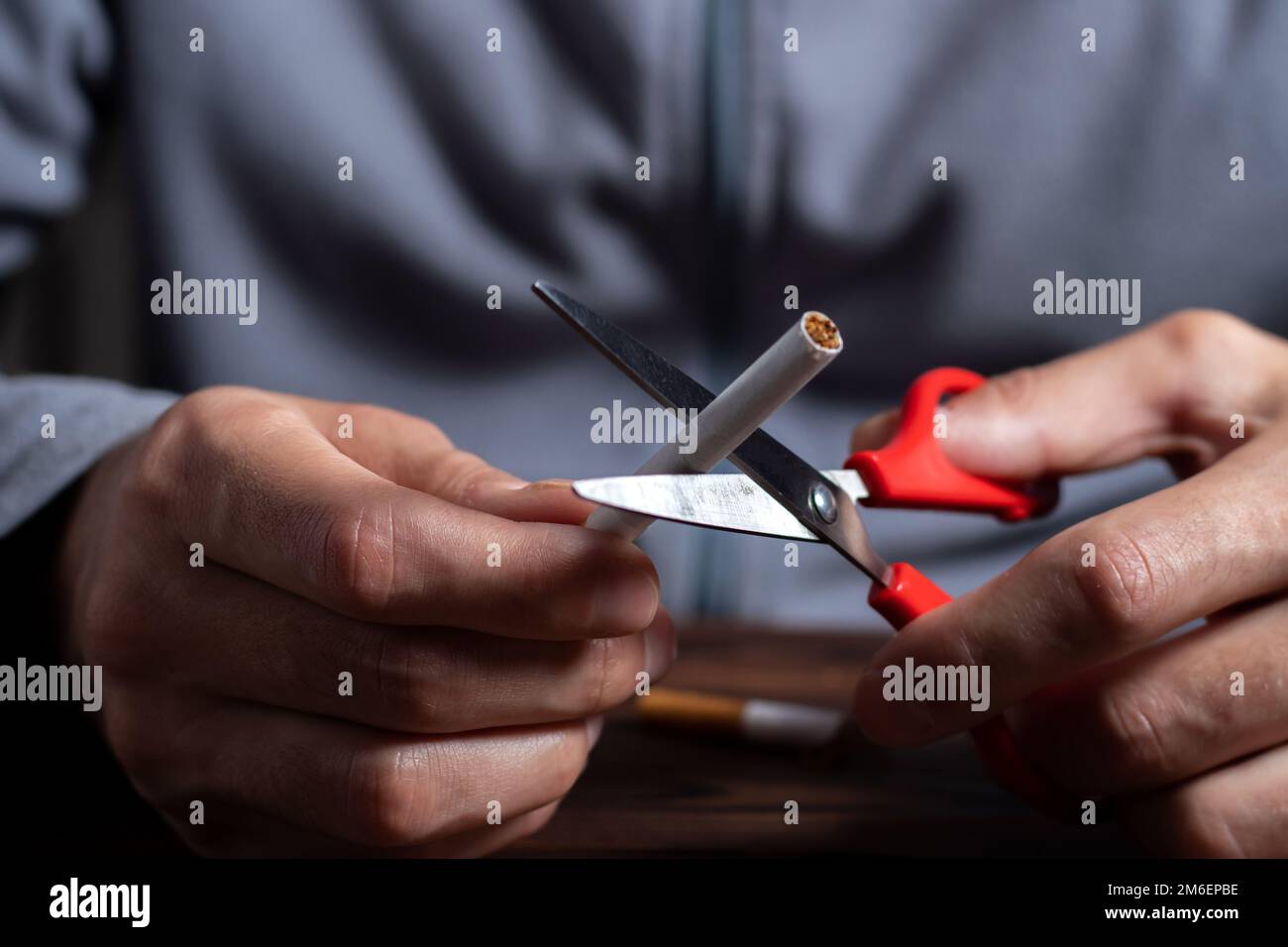 The concept of the fight against smoking and nicotine addiction. A man ...