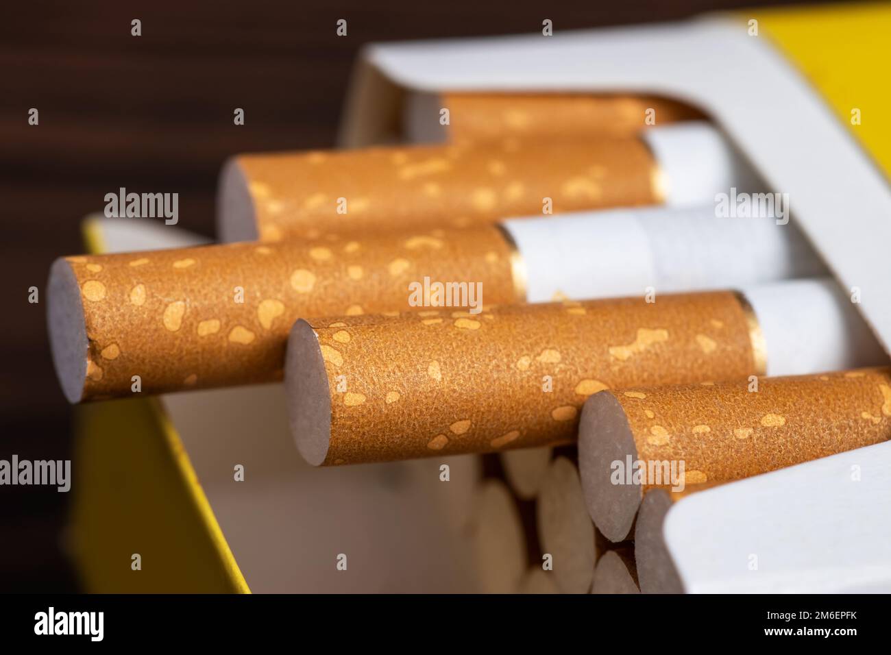 Close up cigarette in pack is addictive to be cancer. smoking reduction ...