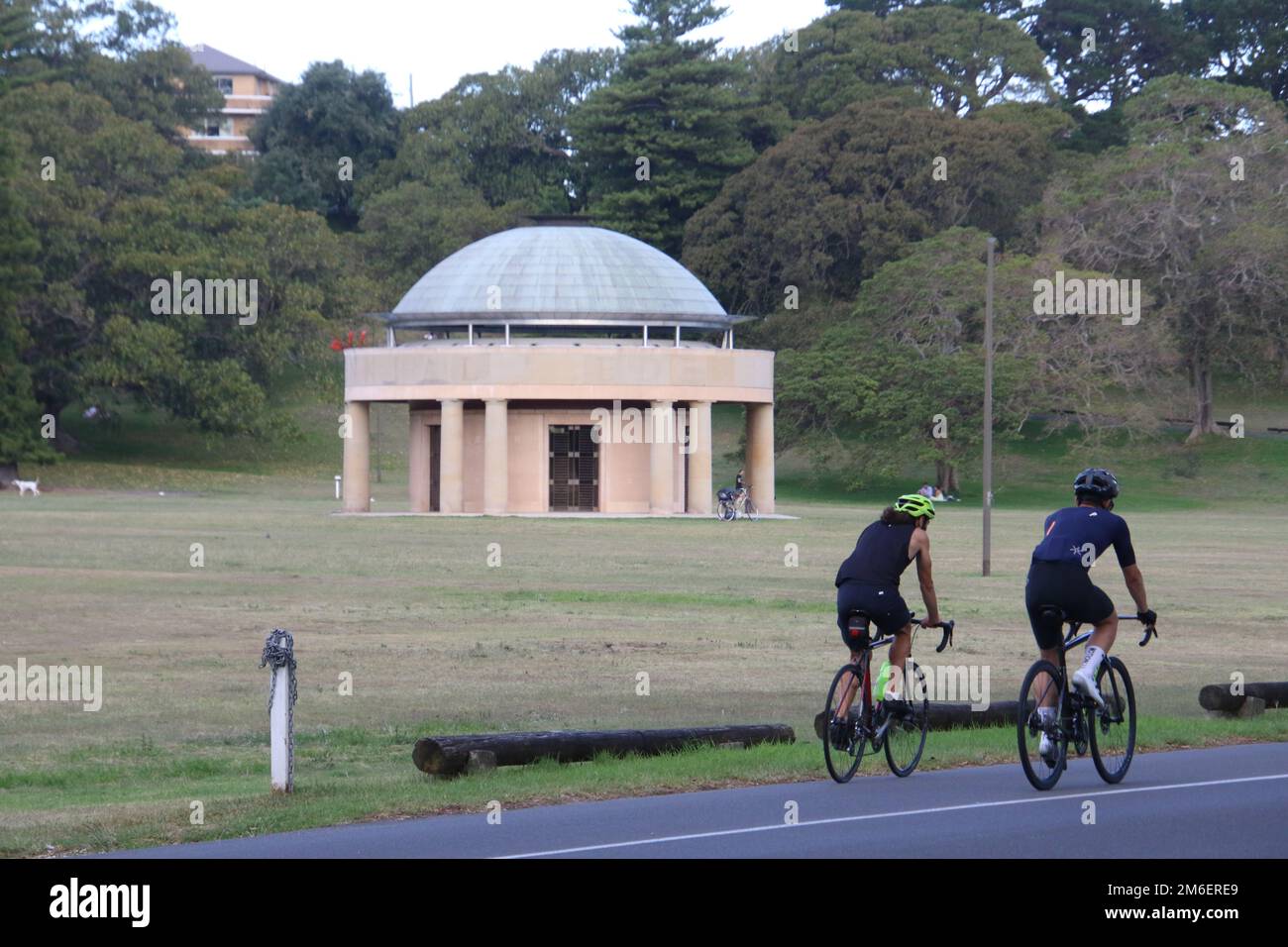 Cyclists pass Federation Pavilion, Centennial Park, Sydney, NSW ...