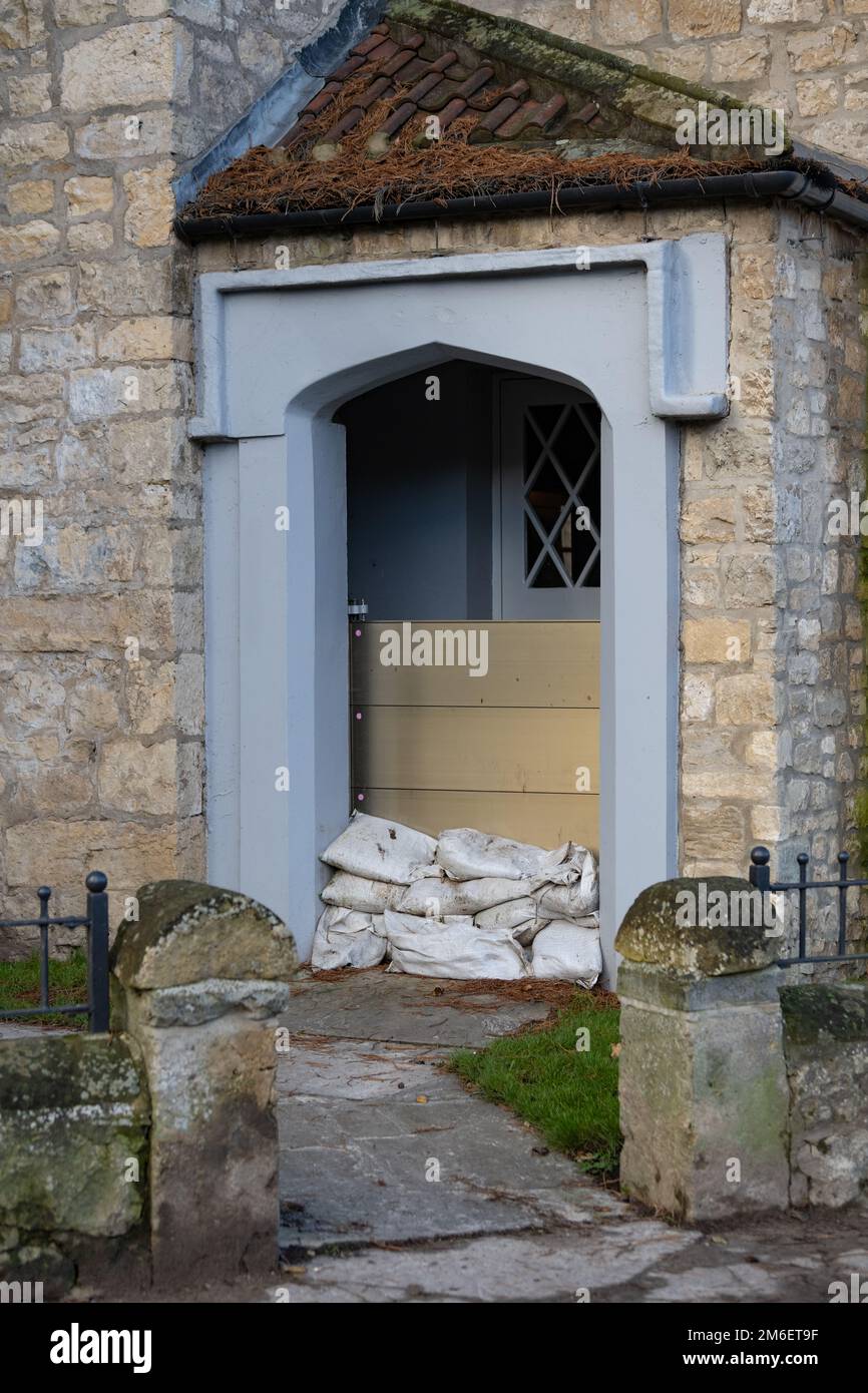 sand bags and flood gate defences at the riverside door to The Boat Inn ...
