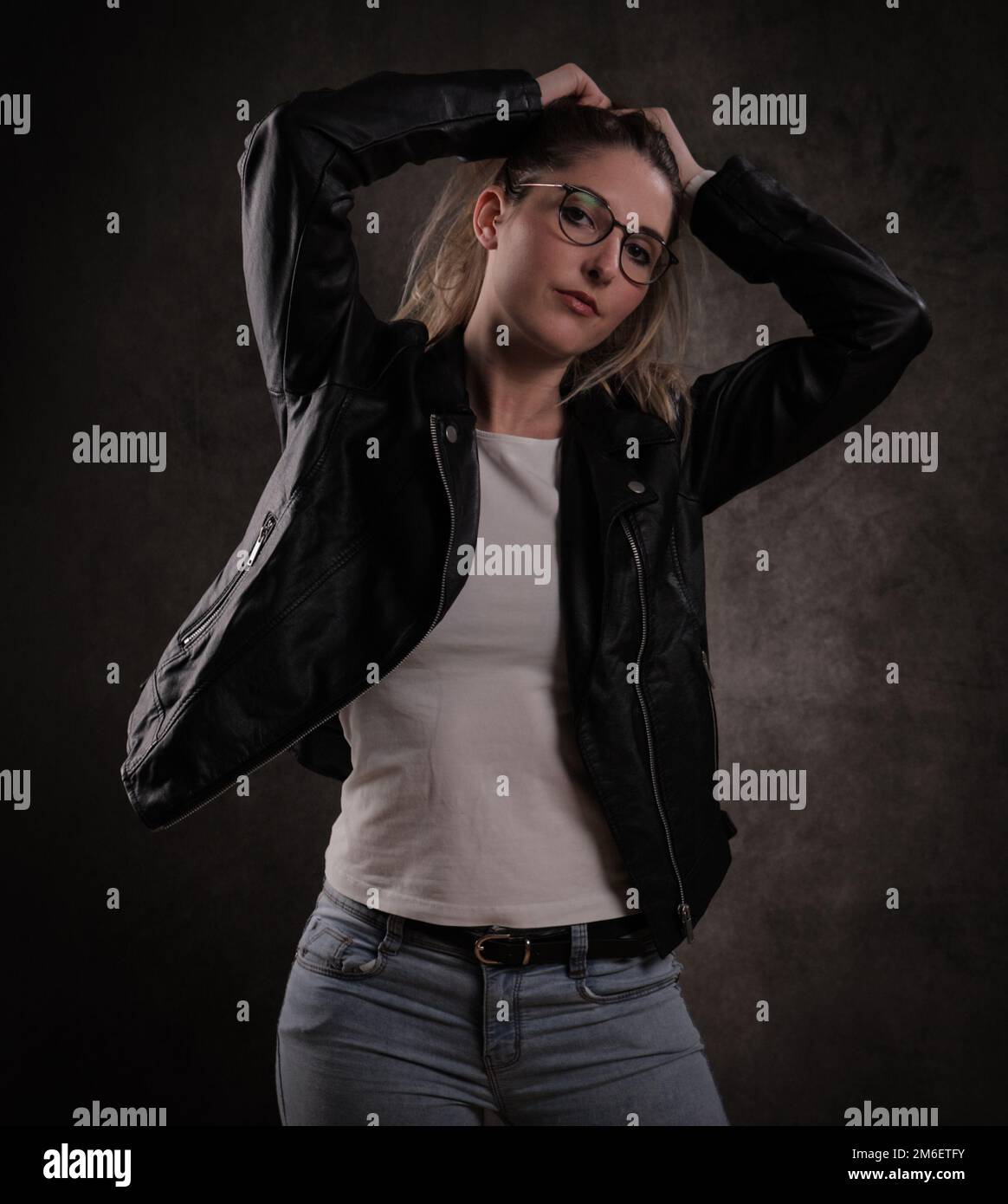 Attractive young woman poses for the camera Stock Photo - Alamy