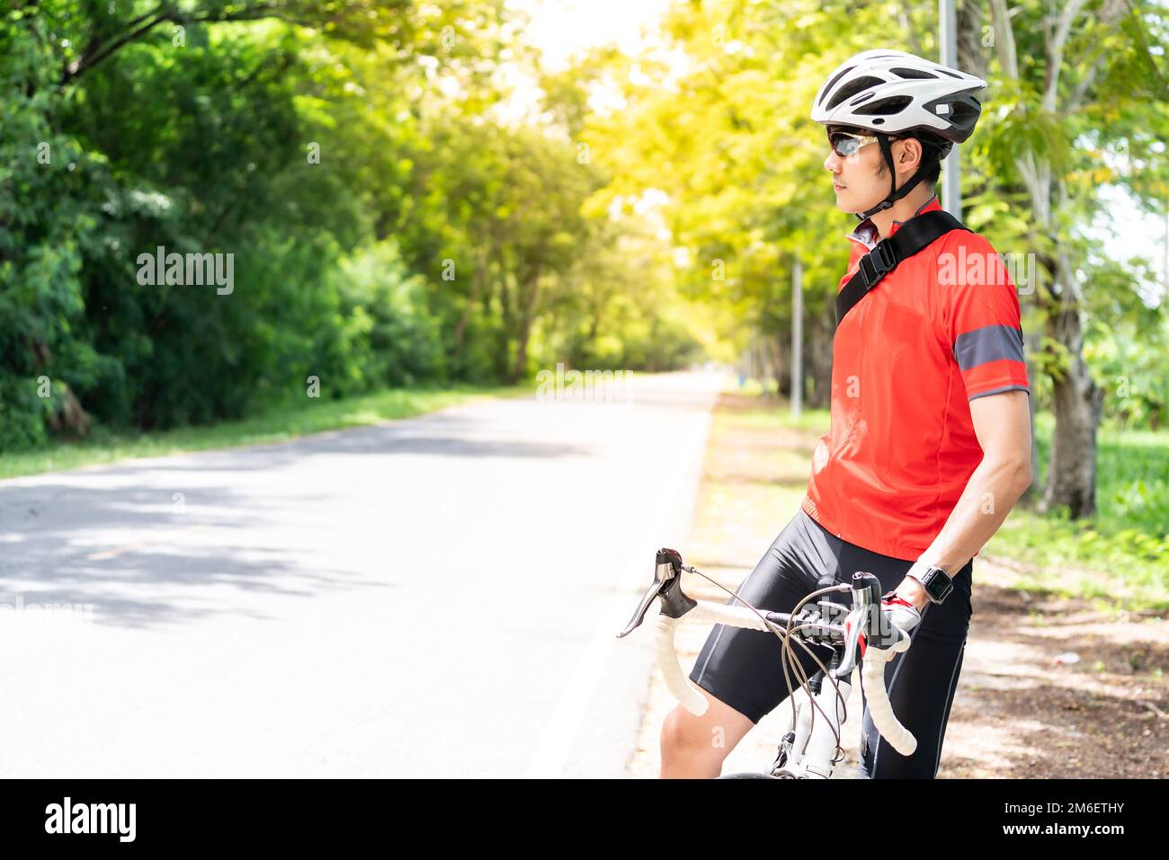 Asian man riding bicycle hi-res stock photography and images - Alamy