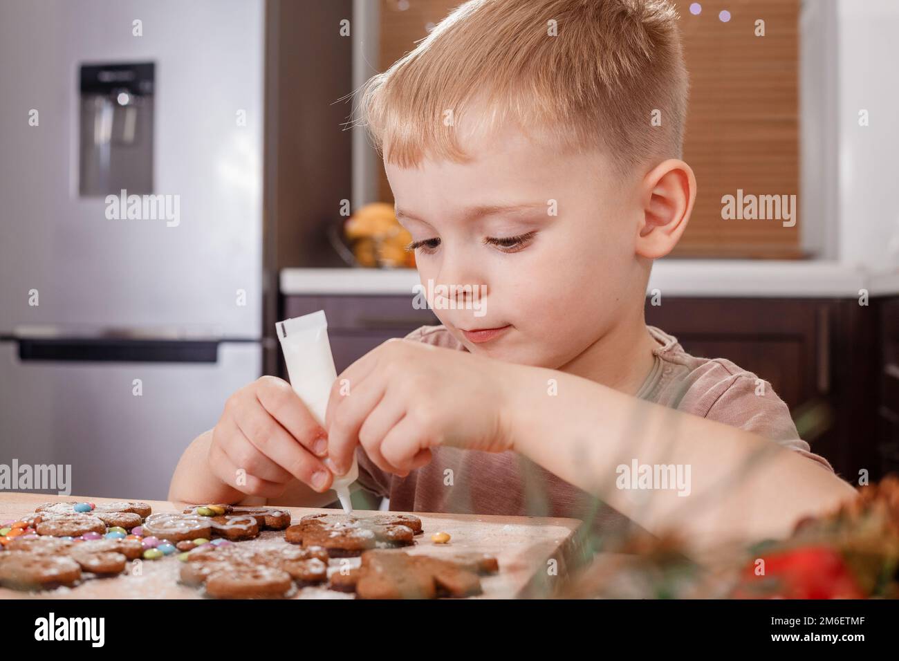 Little boy painting gingerbread man. Handmade Christmas gift ideas ...