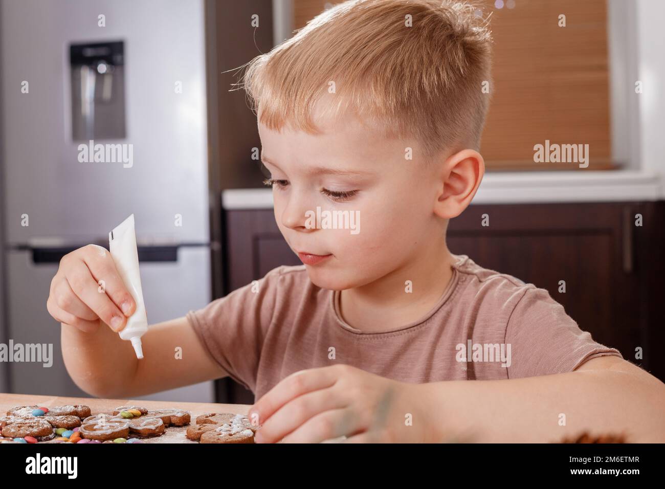 Little boy painting gingerbread man. Handmade Christmas gift ideas ...