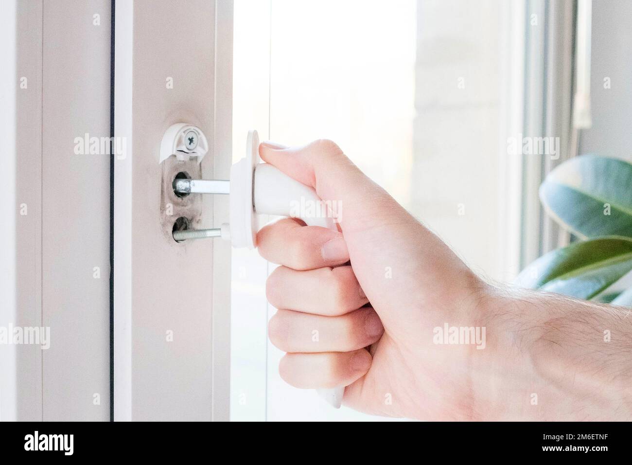 Broke the window handle. Holds her in his arms Stock Photo - Alamy