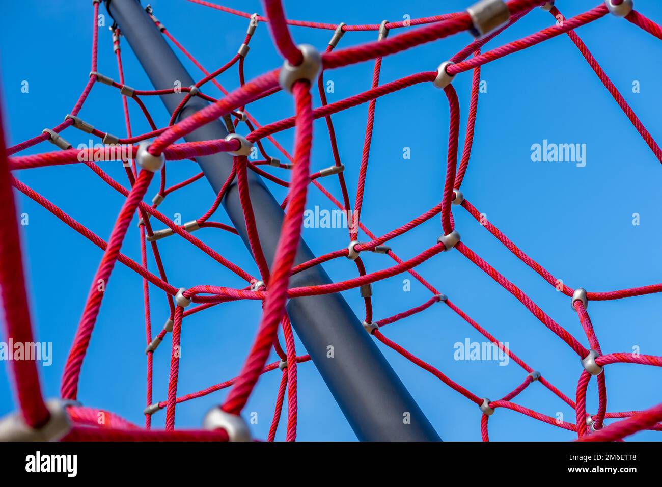 Red ropes on playground against the blue sky Stock Photo - Alamy