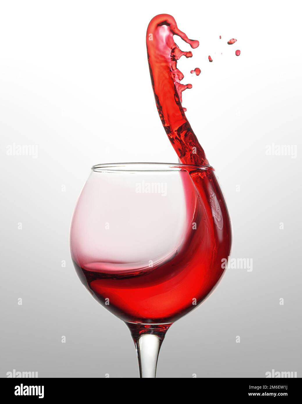 A splash of wine in the glass Stock Photo - Alamy