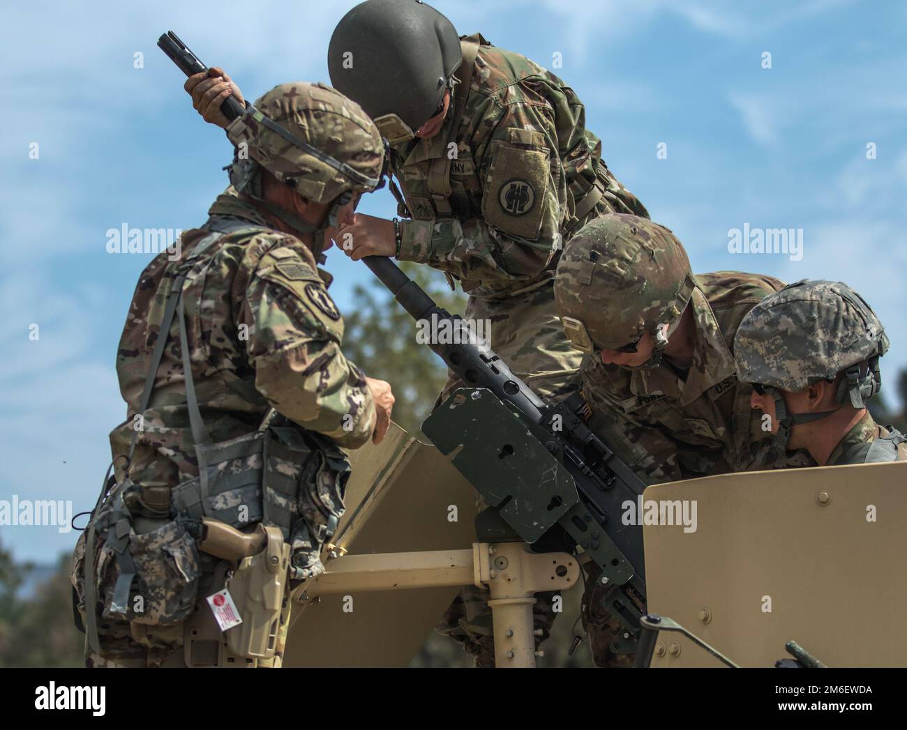 Soldiers from the 366th Military Police Company mounts an M2 .50 ...
