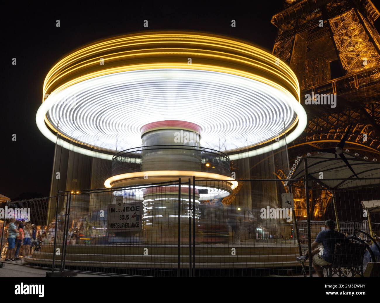 Paris, France Cityscape with the carousel and the illuminated Eiffel ...