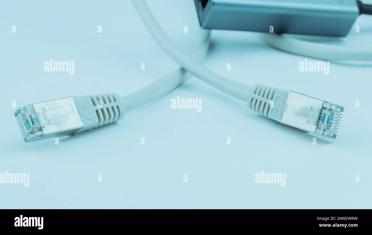 A Ethernet RJ 45 LAN To USB in blue background Stock Photo - Alamy