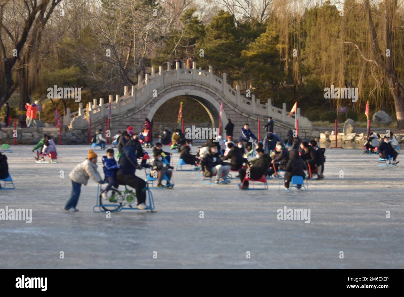 Visitors play at the ice rink in the Old Summer Palace to celebrate the ...