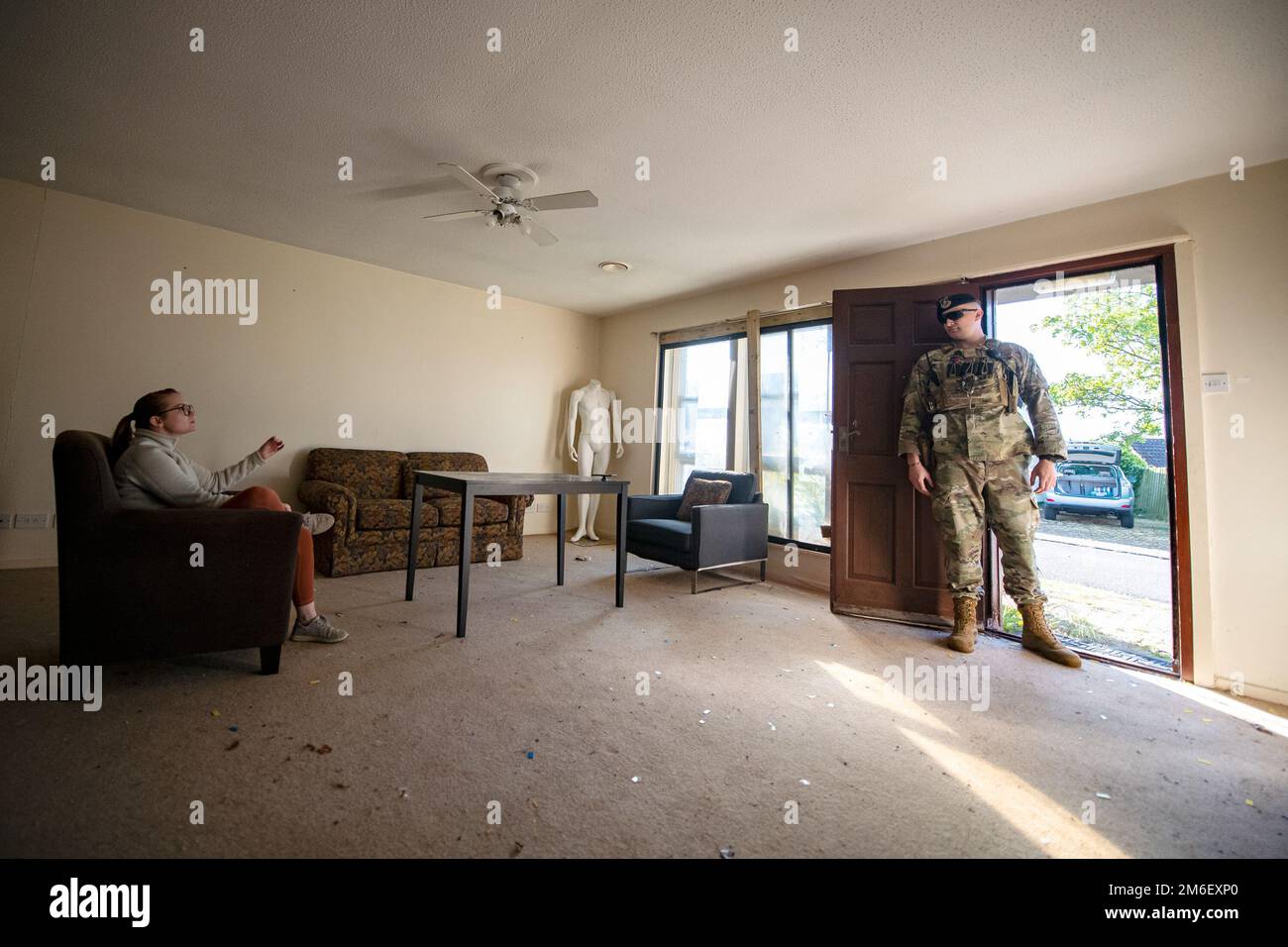 An Airman from the 423d Security Forces Squadron, right, speaks with a ...