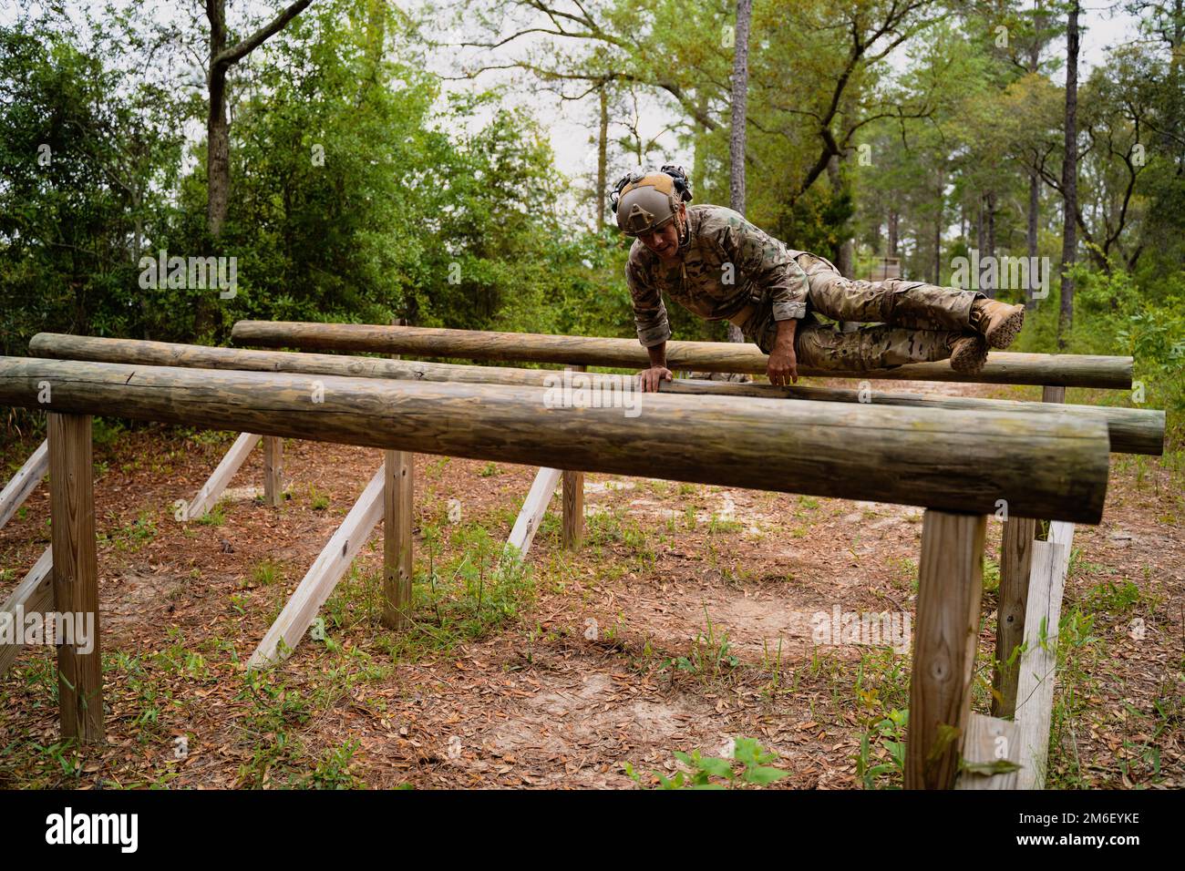 Members of the 7th Special Forces Group (Airborne) pass an obstacle ...