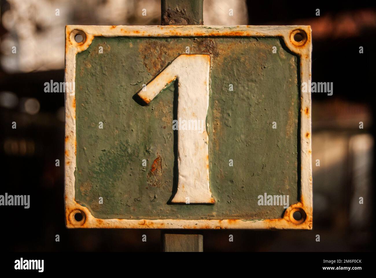 Old retro weathered cast iron plate with number 1 closeup Stock Photo ...