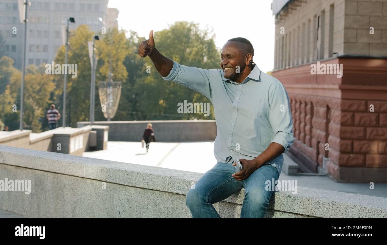 African man waving welcoming on hi-res stock photography and images - Alamy