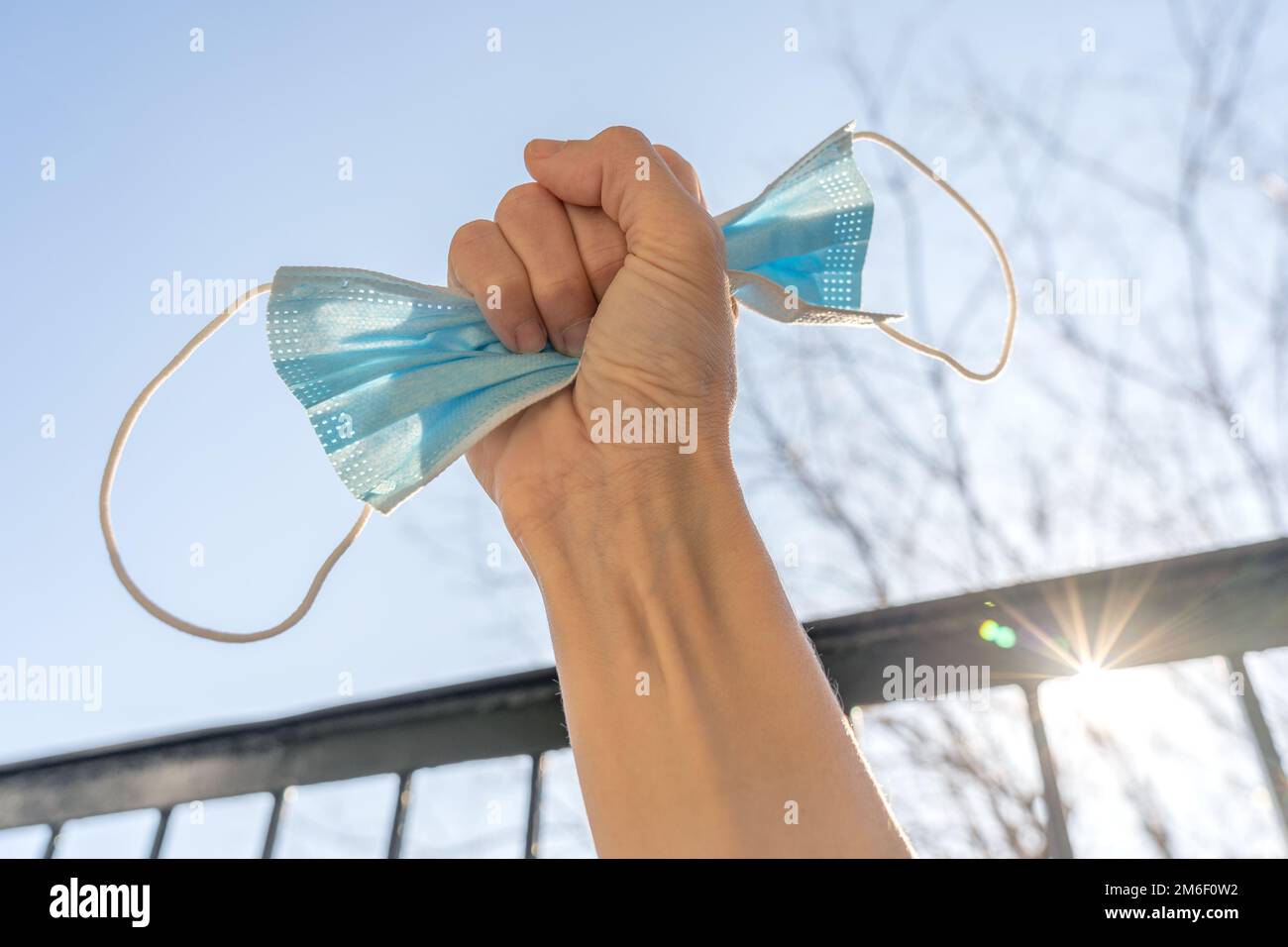 Close up of hand and surgical mask, beating epidemic Stock Photo - Alamy