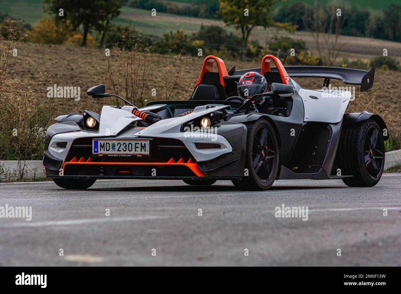 KTM X-Bow on an old racing car in rally Mille Miglia 2020 the famous ...