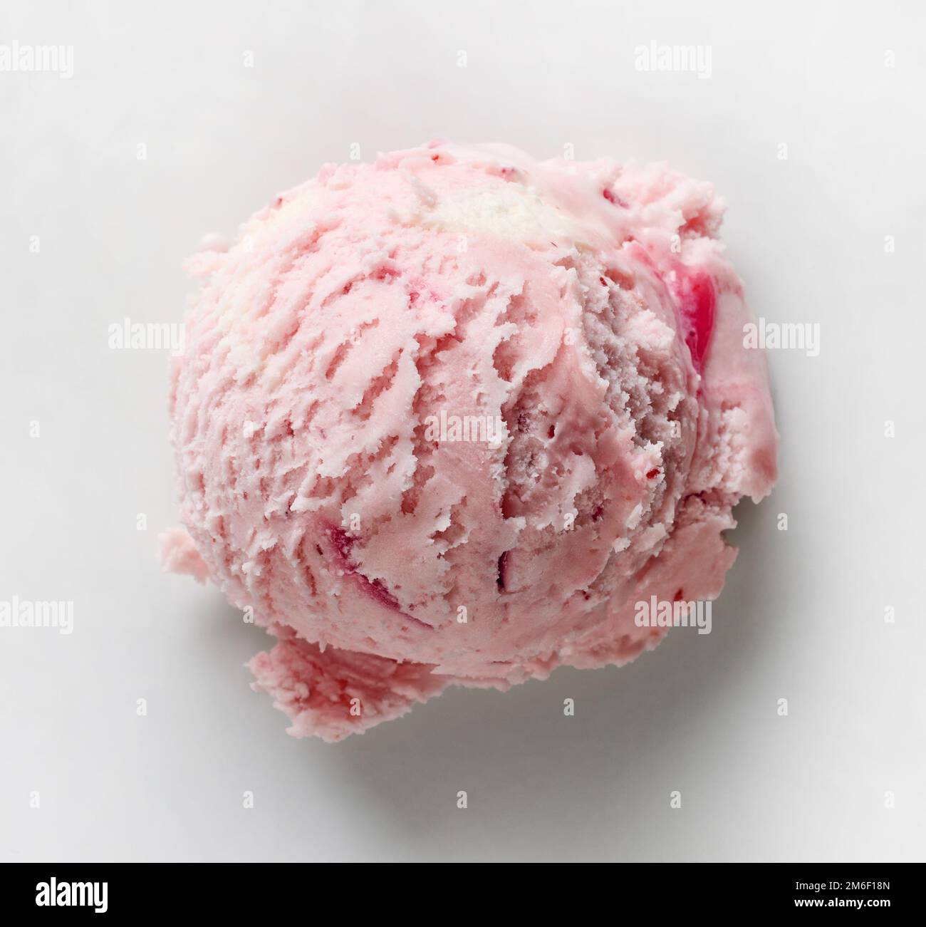 pink ice cream ball on white background, top view Stock Photo - Alamy