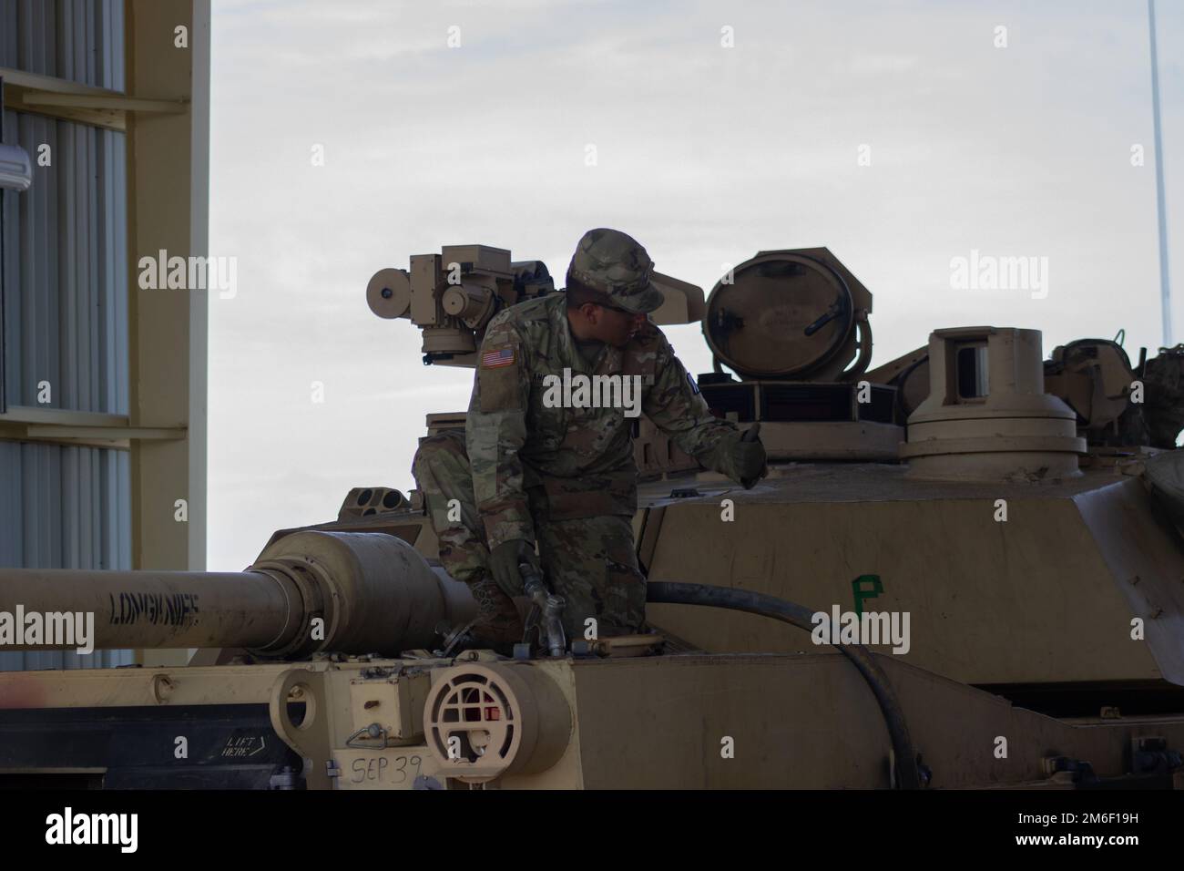 U.S. Army Spc. Alejandro Anguiano, an armored vehicle crewmember with ...