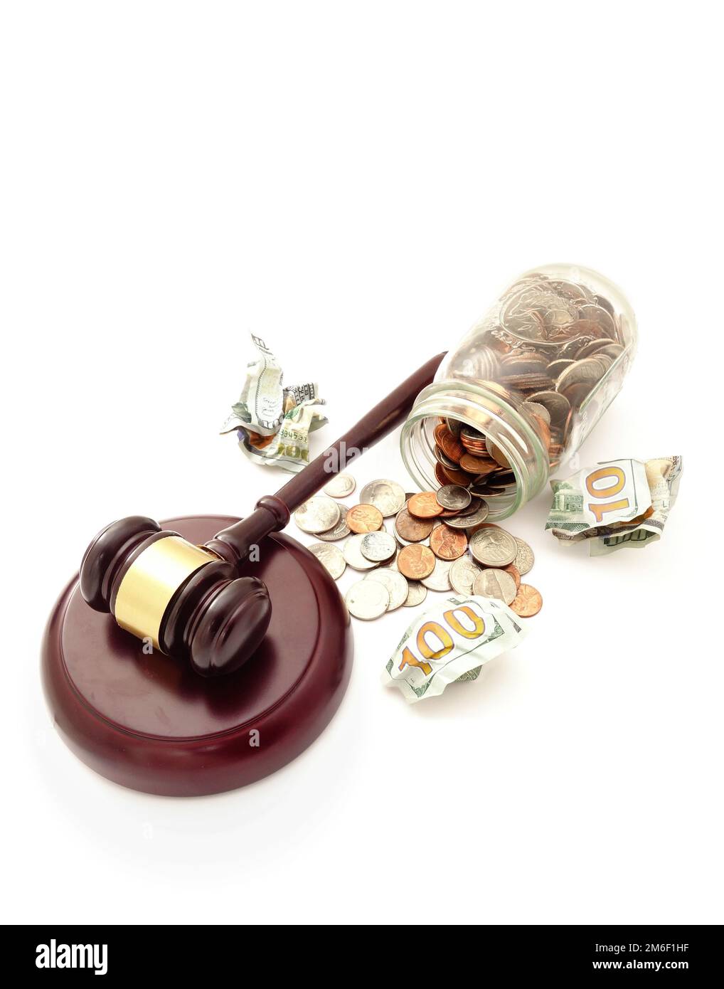 Legal gavel with crumpled hundred dollar bills and coin jar isolated on ...