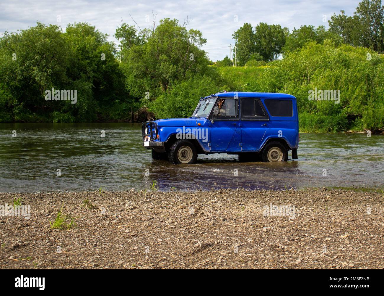 Blue car rides on road hi-res stock photography and images - Alamy