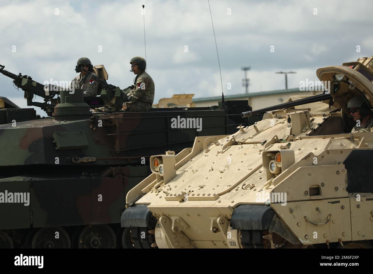 From the left, U.S. Army Staff Sgt. Alex Jobe, tank commander and Spc ...
