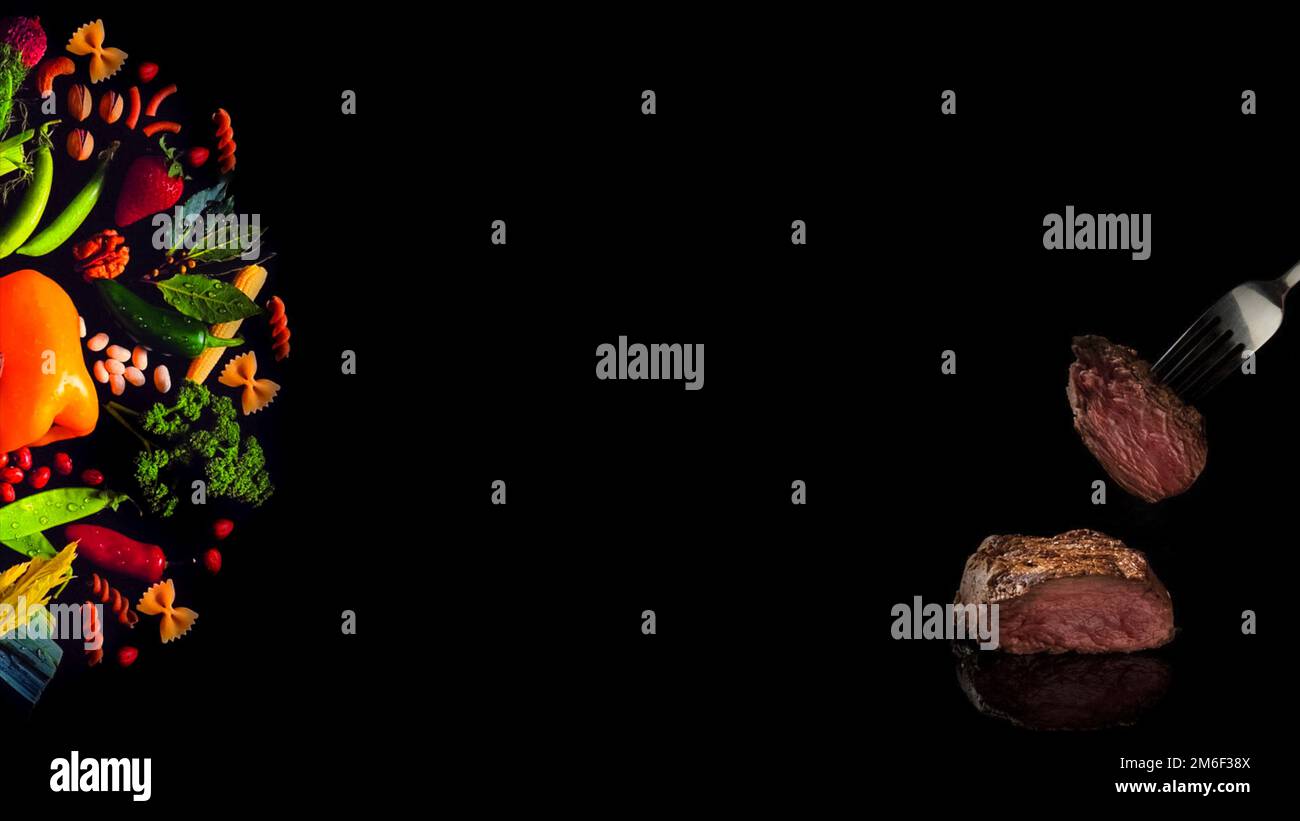 Food on black background. Vegetarian food versus meat Stock Photo - Alamy