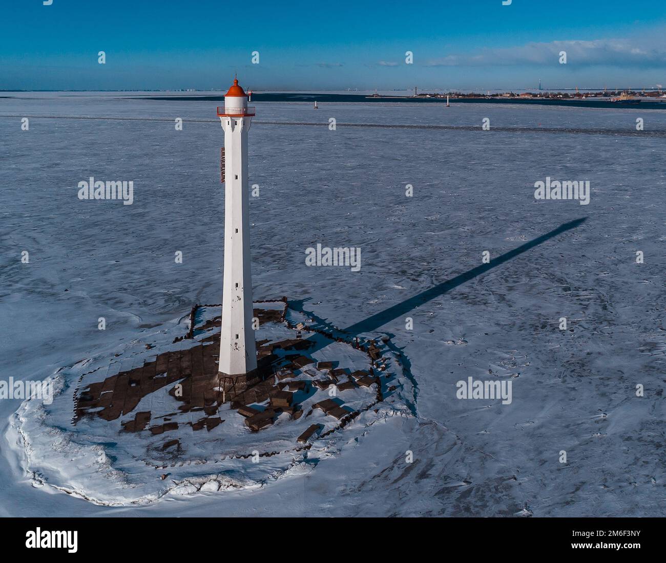 Lighthouse is in winter on the river bank. View from above Stock Photo ...