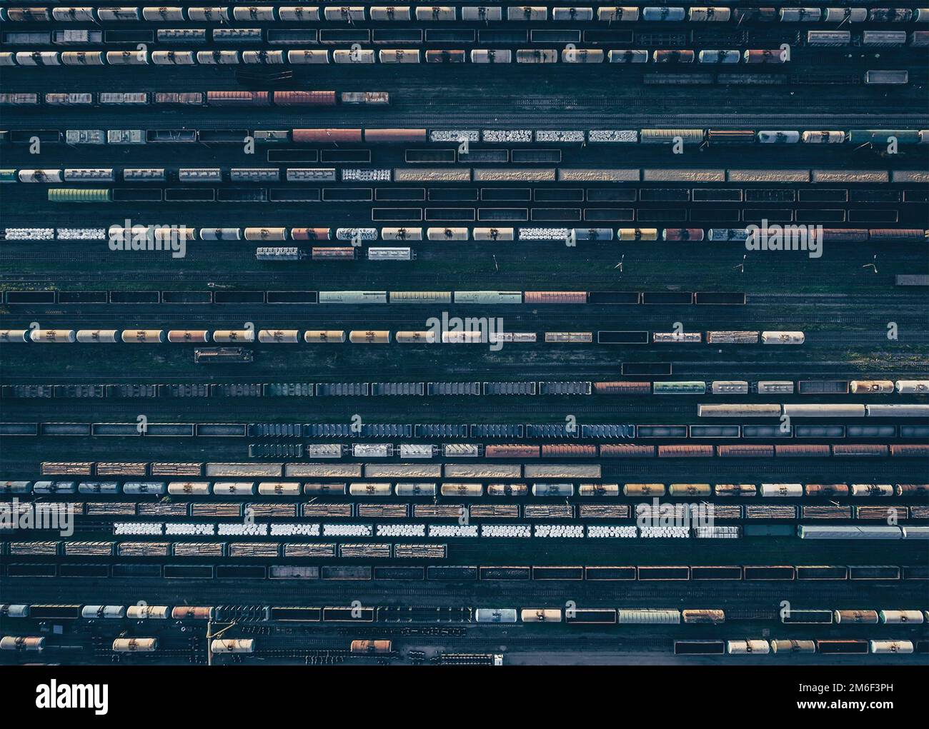 View from above at railway freight station. Cargo wagons with cargo and ...