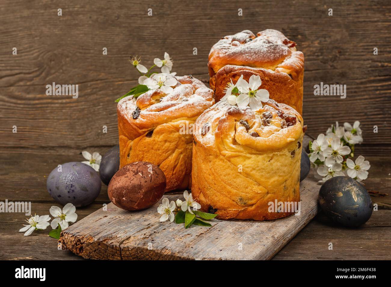 Easter cake Cruffin or sweet bread kulich with painted eggs ...