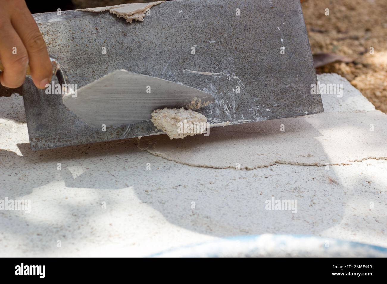 A closeup of the screed patching the concrete ground Stock Photo - Alamy