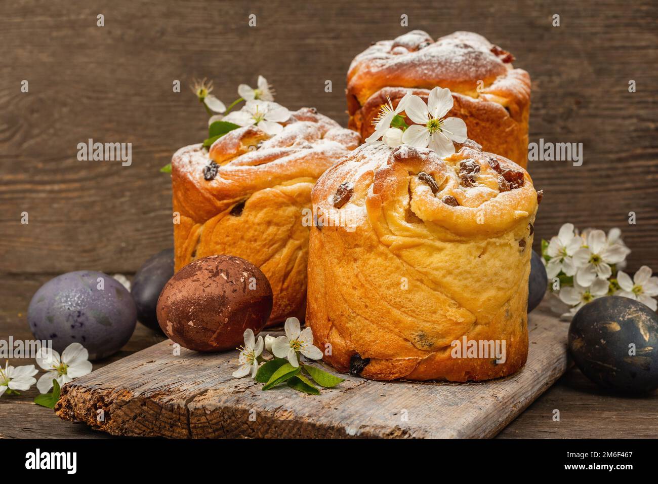 Easter cake Cruffin or sweet bread kulich with painted eggs ...