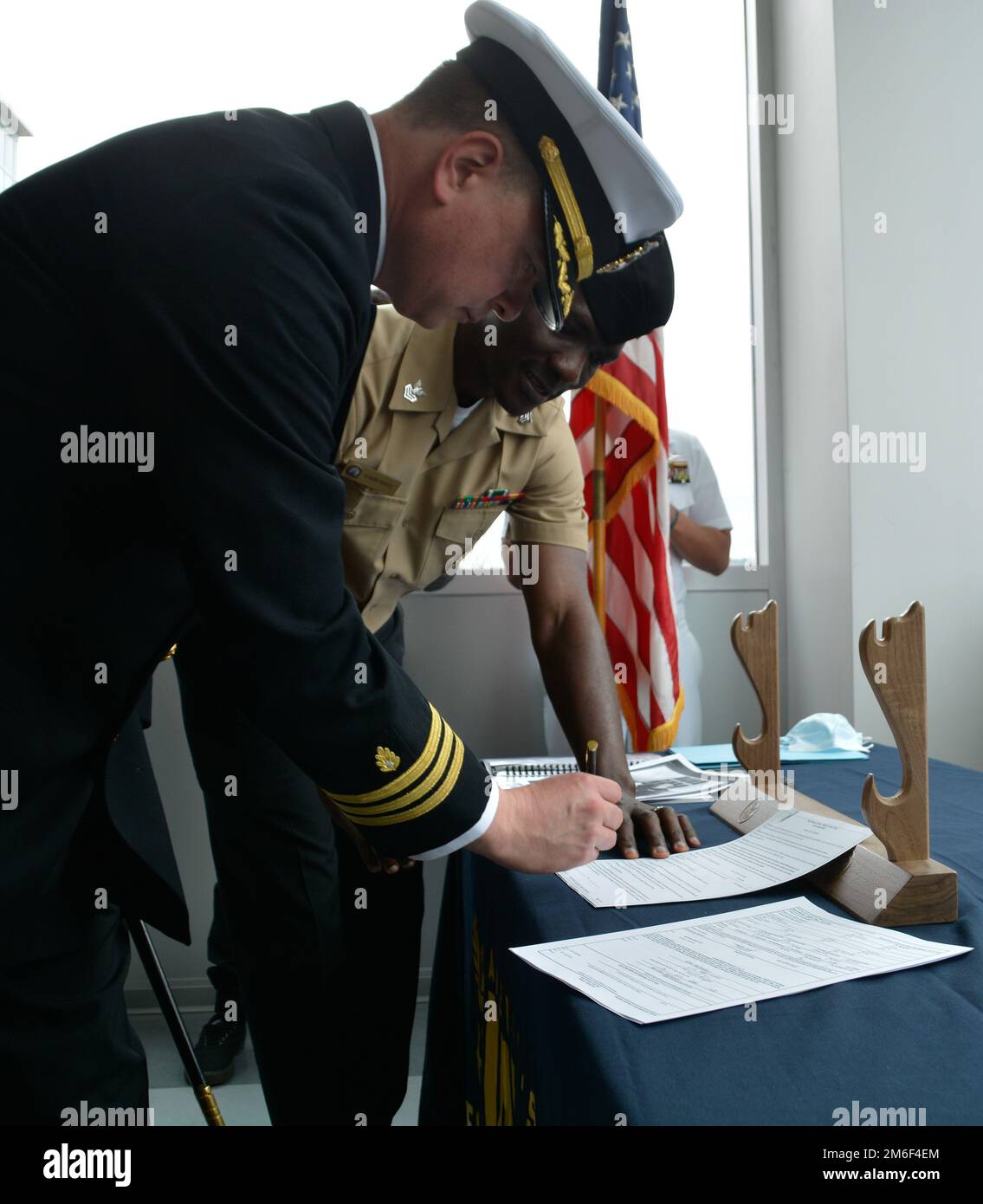 Dr. Richard King is commissioned as Cmdr. Richard King in a ...