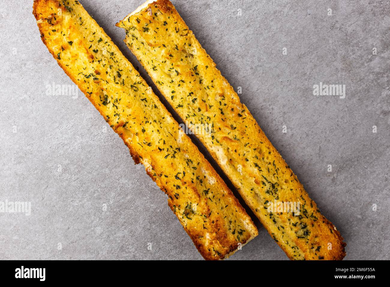 Garlic Baguette Sticks with Garlic, Butter and Herbs Stock Photo - Alamy