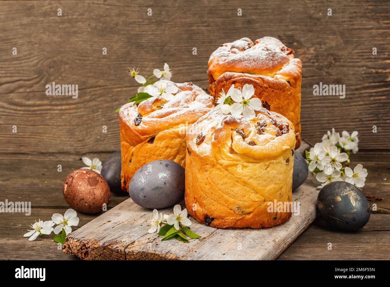 Easter cake Cruffin or sweet bread kulich with painted eggs ...