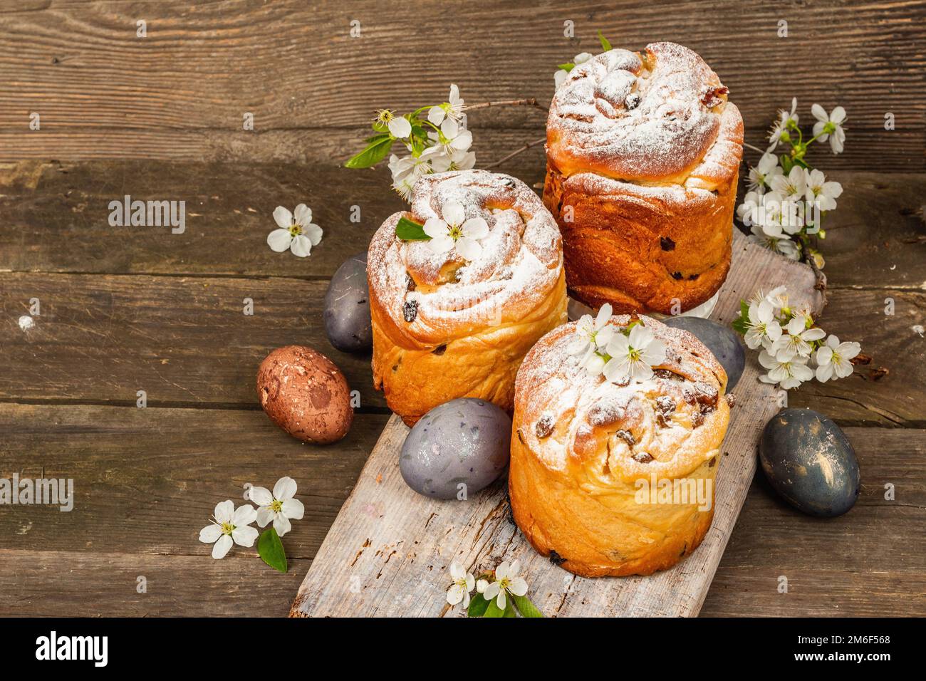 Easter cake Cruffin or sweet bread kulich with painted eggs ...